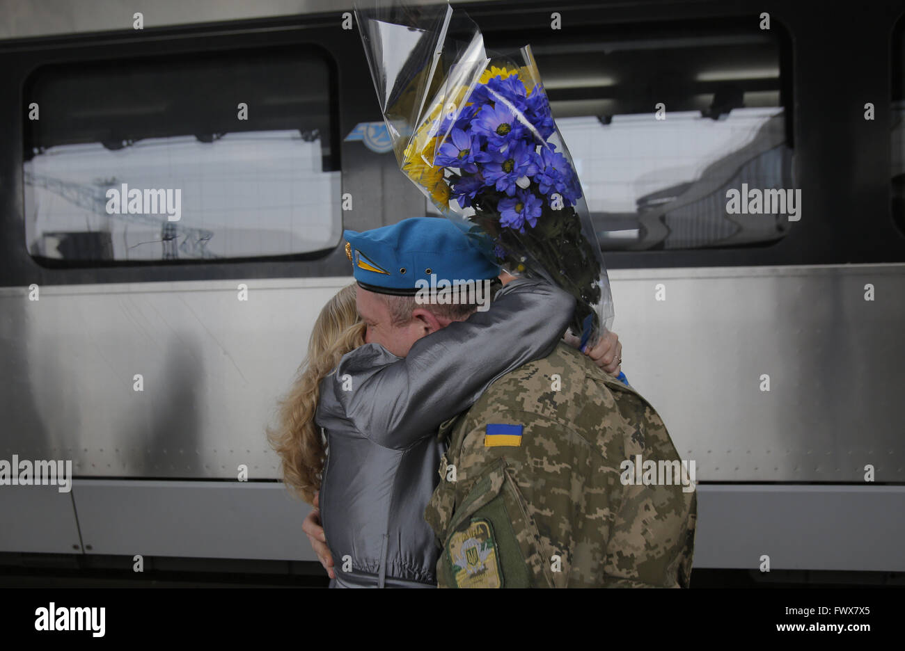 A Ukrainian serviceman hugs a woman during during a meeting at the ...