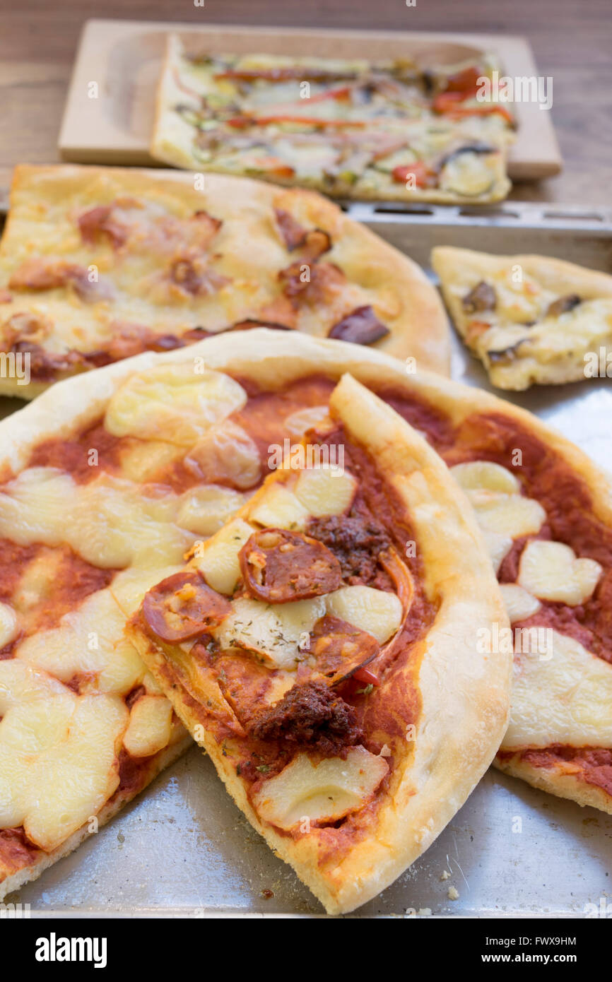 wedge pizza with thin spicy salami called devil pizza Stock Photo - Alamy