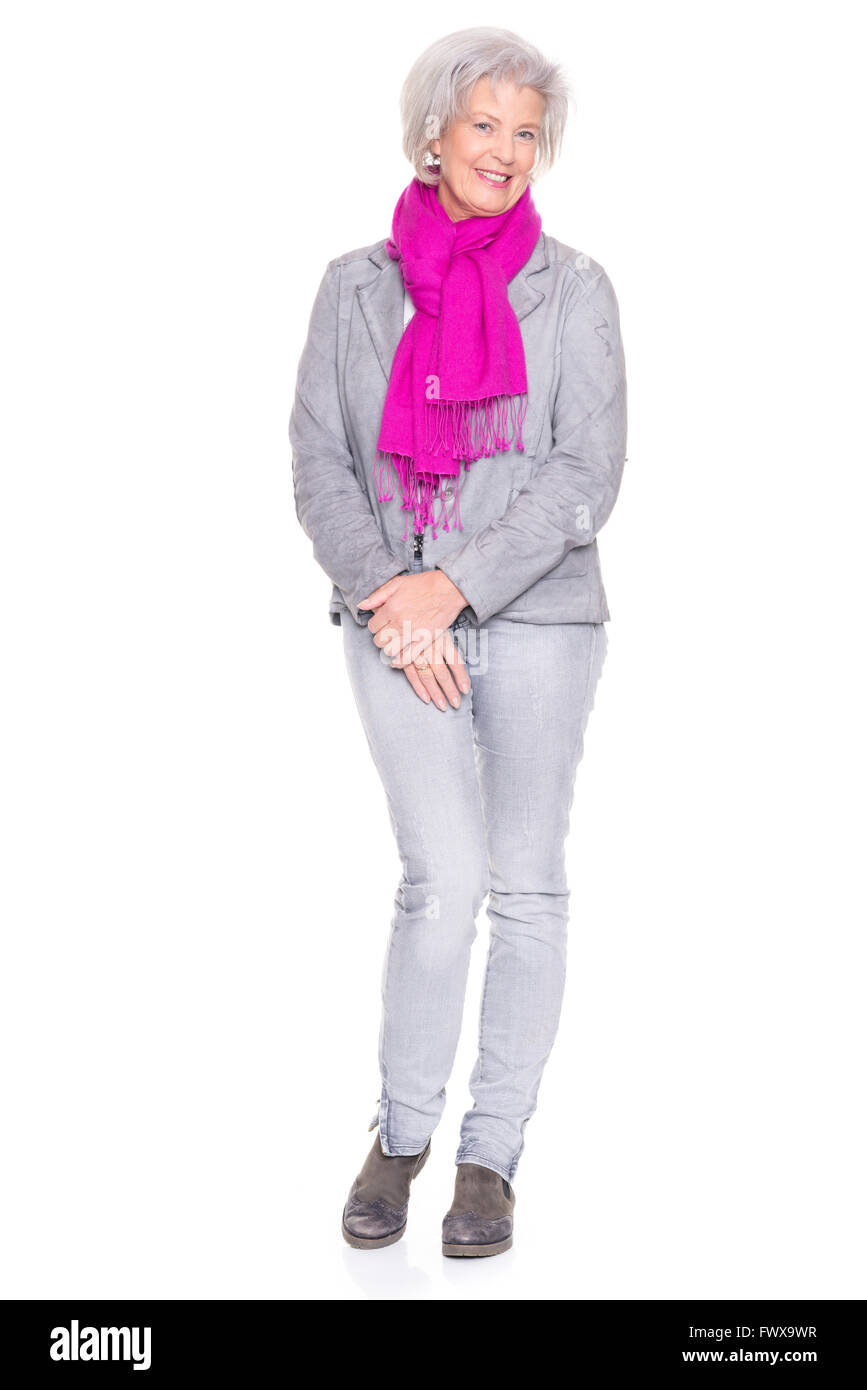 Senior woman standing in front of white background Stock Photo - Alamy