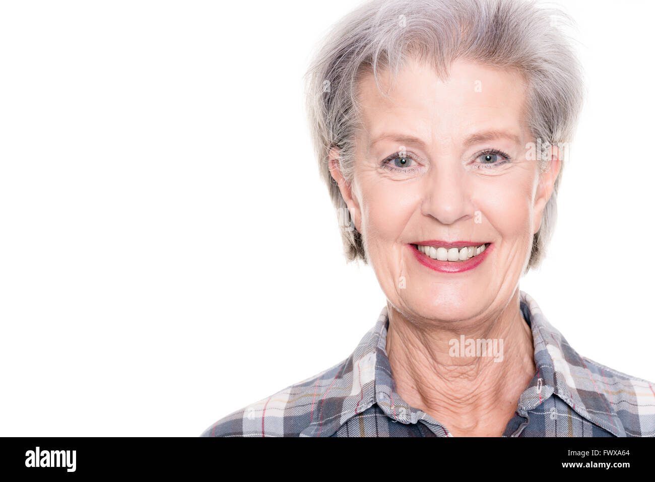 Active senior woman in front of white background Stock Photo - Alamy