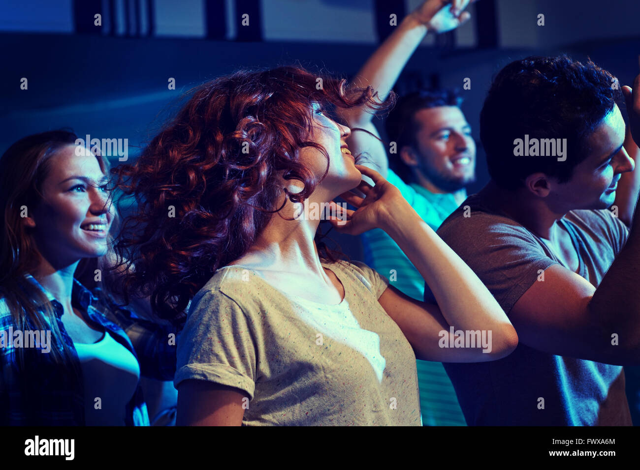 happy friends dancing at night club Stock Photo - Alamy