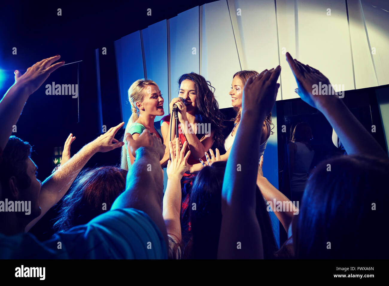 Happy singing crowd hi-res stock photography and images - Alamy