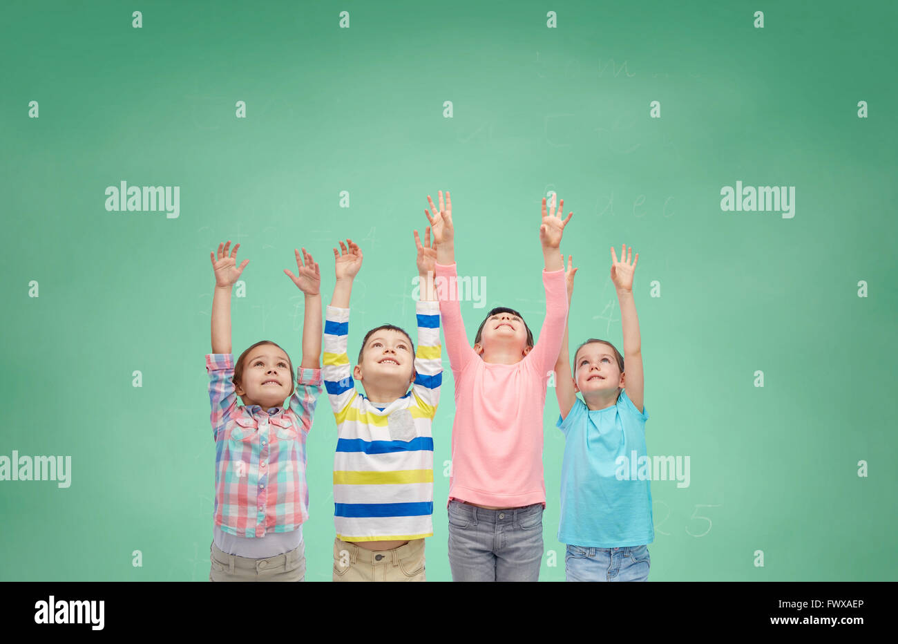happy children celebrating victory over green Stock Photo - Alamy