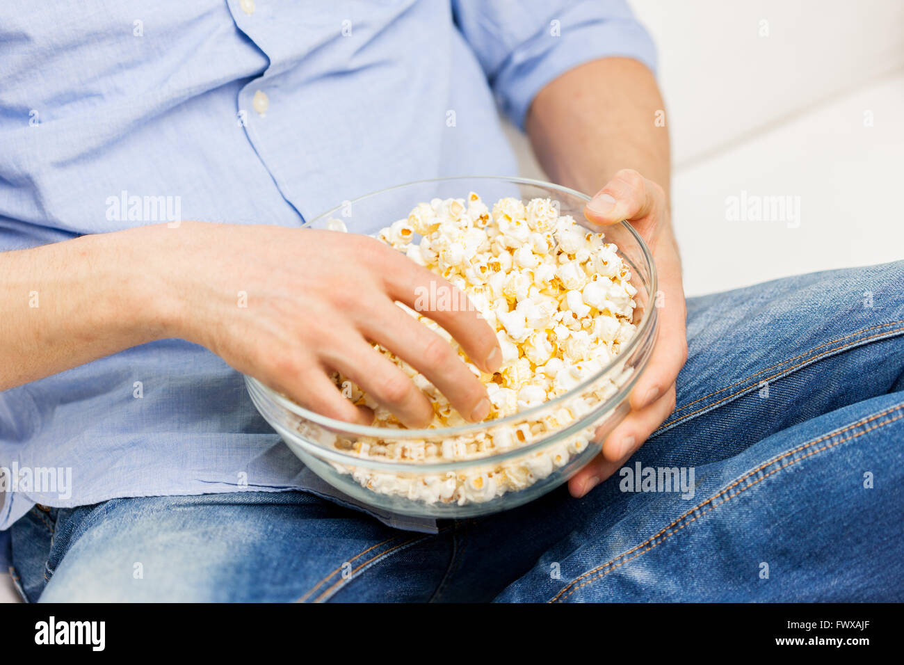 Man eating popcorn hi-res stock photography and images - Alamy