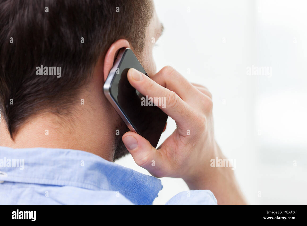 Back view smartphone man holding hi-res stock photography and images ...