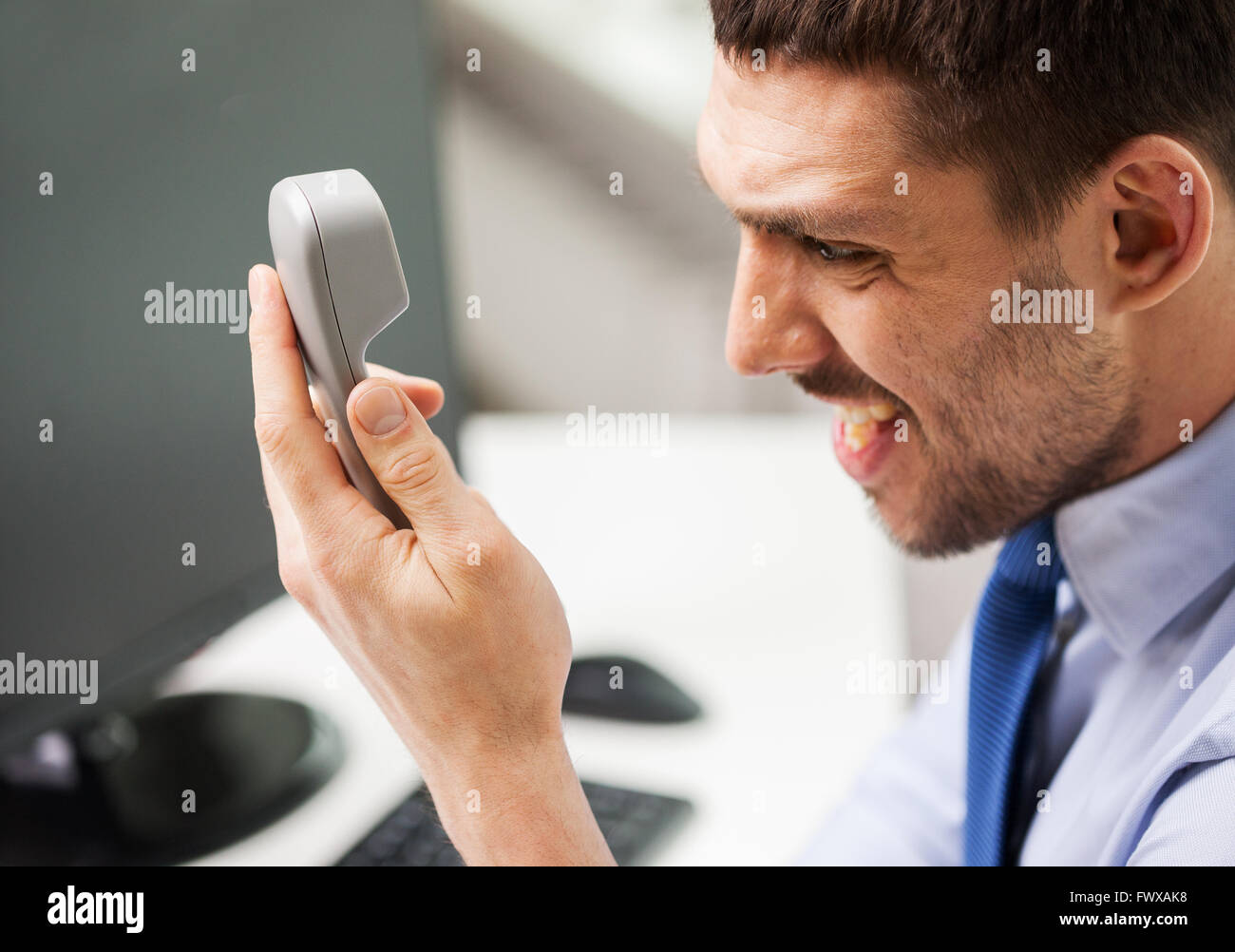 Angry young man shouting telephone hi-res stock photography and images ...