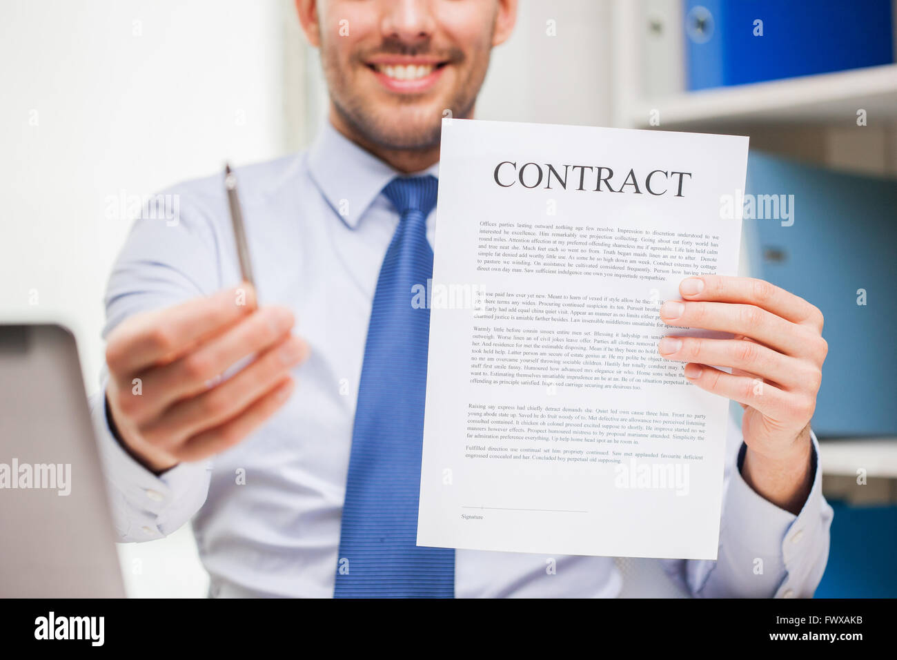 Hispanic businessman signing paper hi-res stock photography and images ...