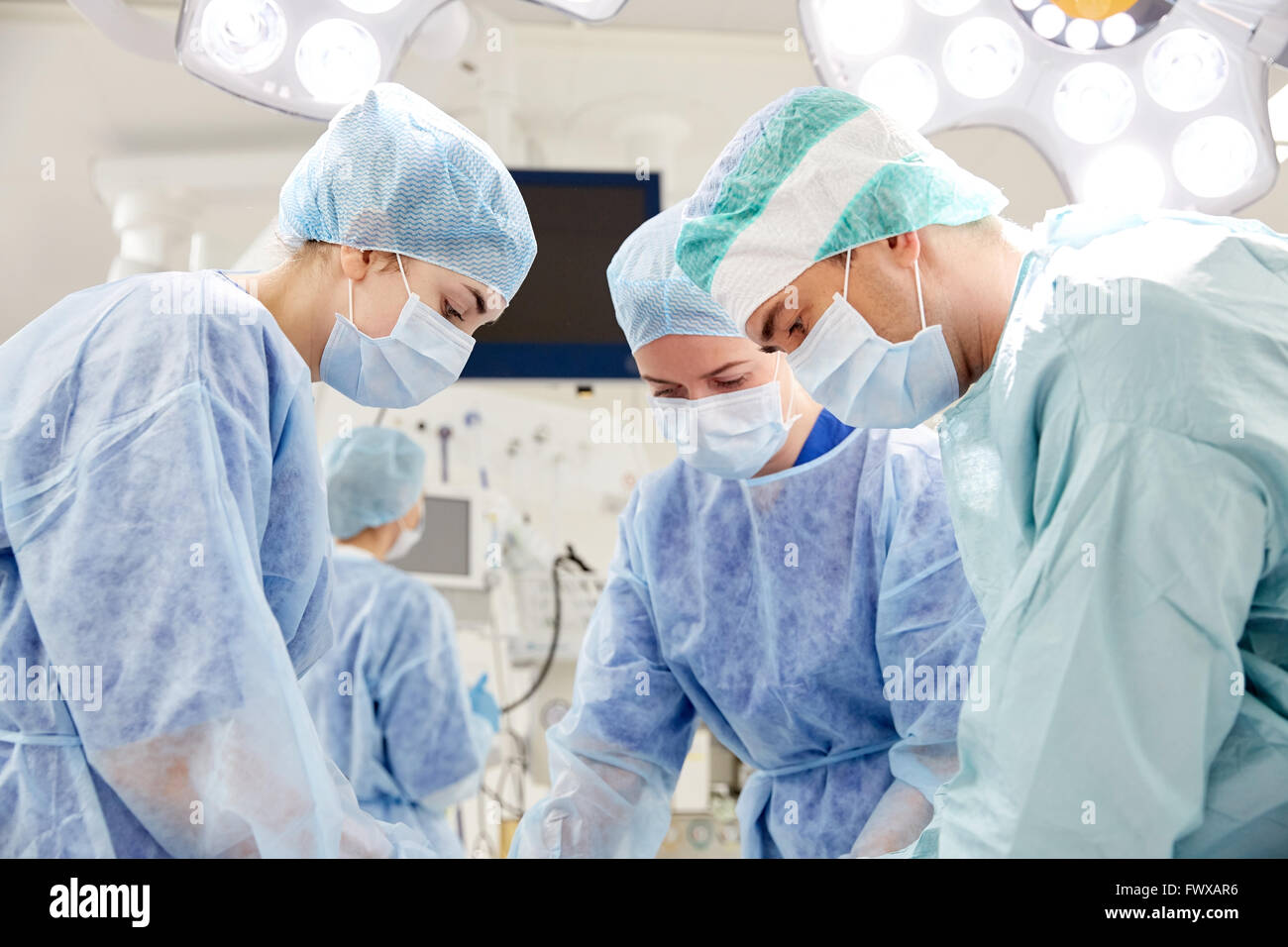 group of surgeons in operating room at hospital Stock Photo - Alamy