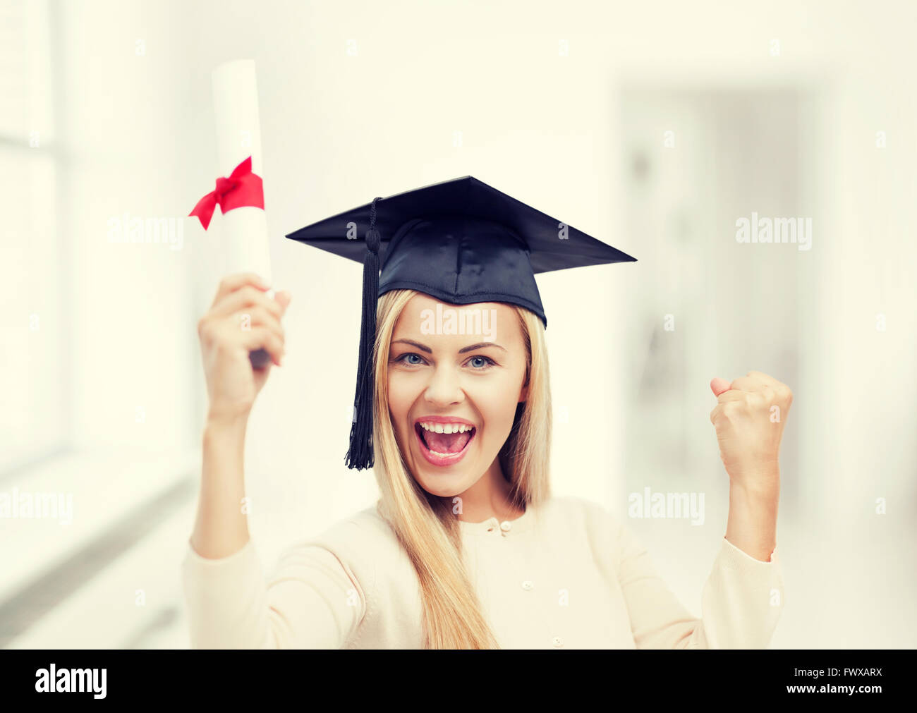 student in graduation cap with certificate Stock Photo - Alamy