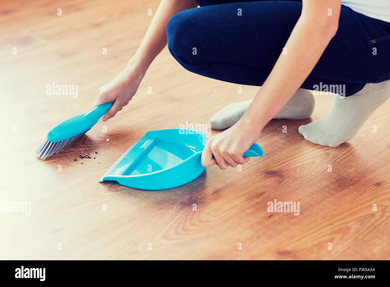 Woman sweeping floor hi-res stock photography and images - Alamy