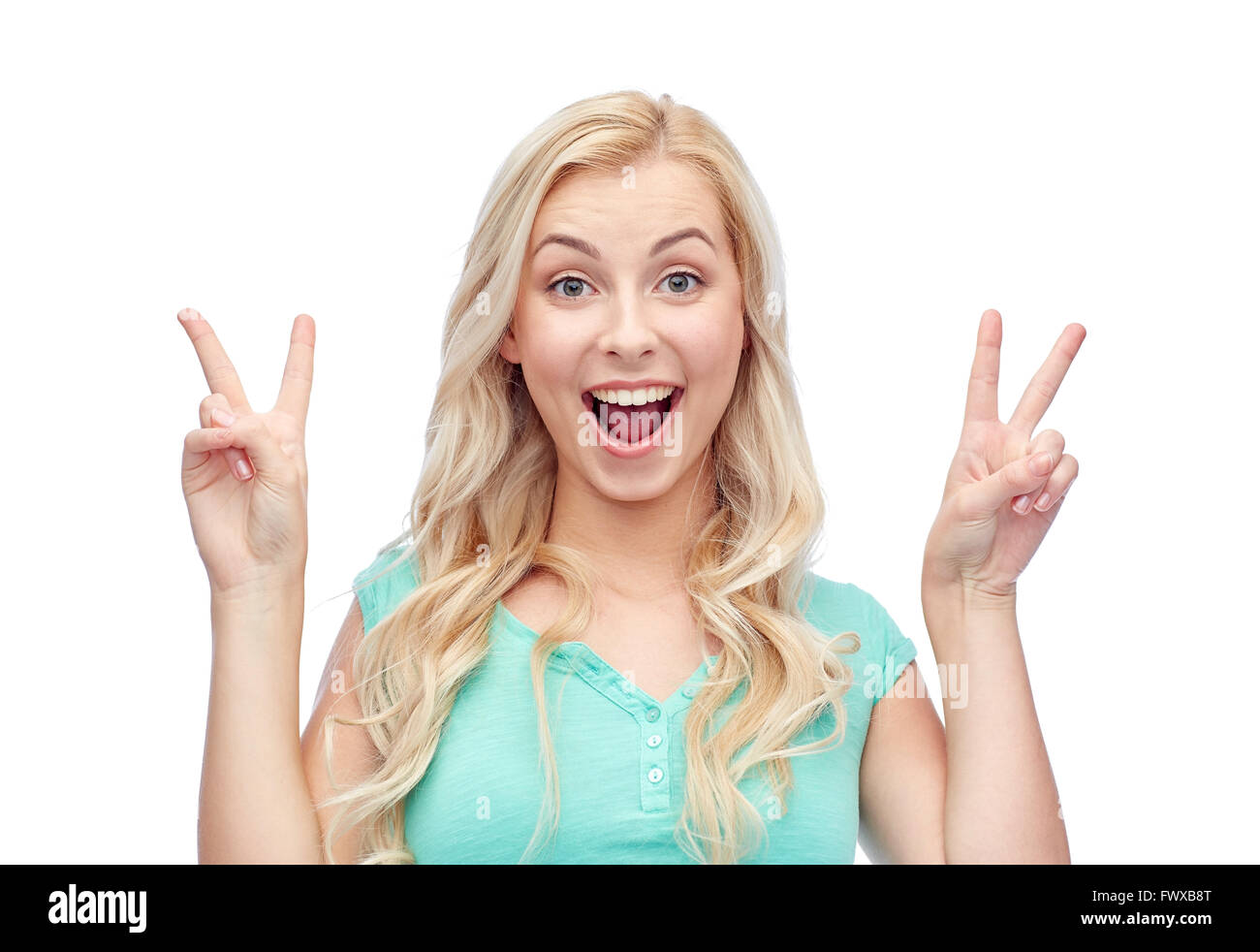 smiling young woman or teenage girl showing peace Stock Photo - Alamy