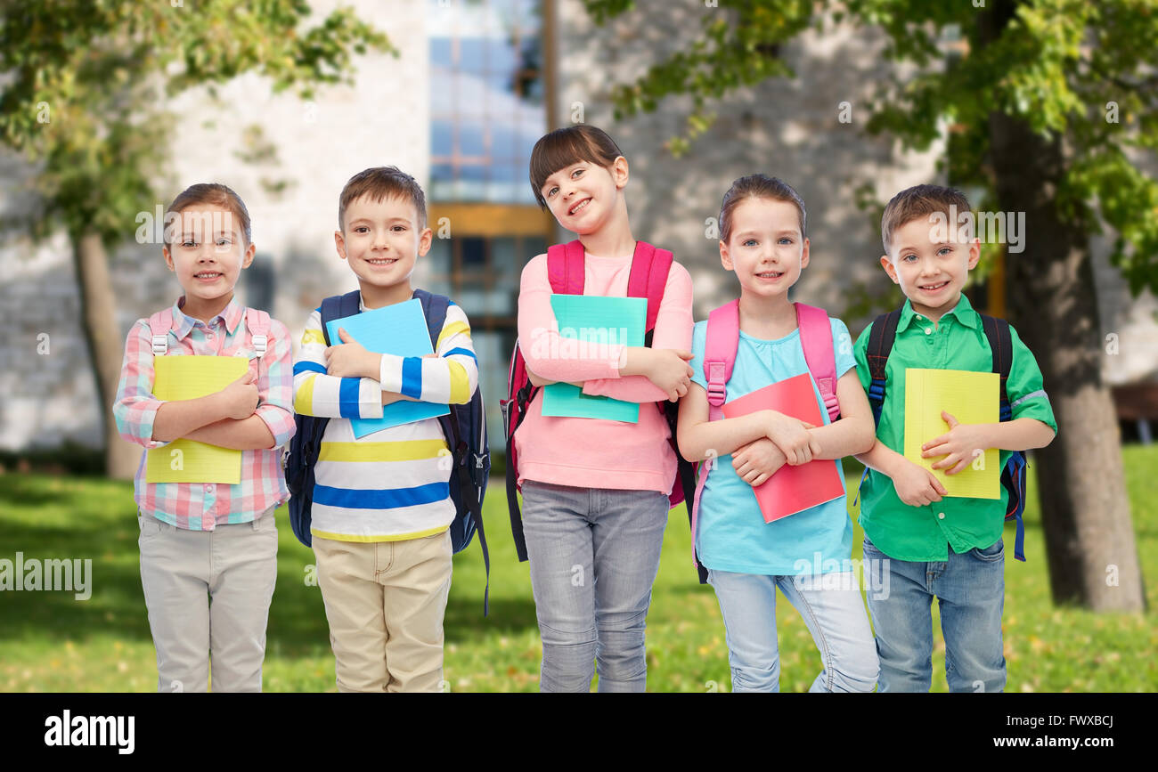 happy children with school bags and notebooks Stock Photo - Alamy