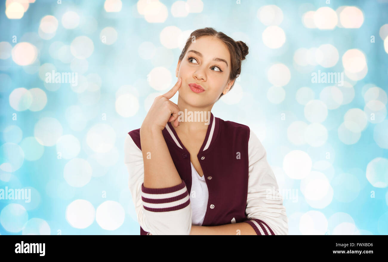happy pretty teenage girl thinking Stock Photo - Alamy