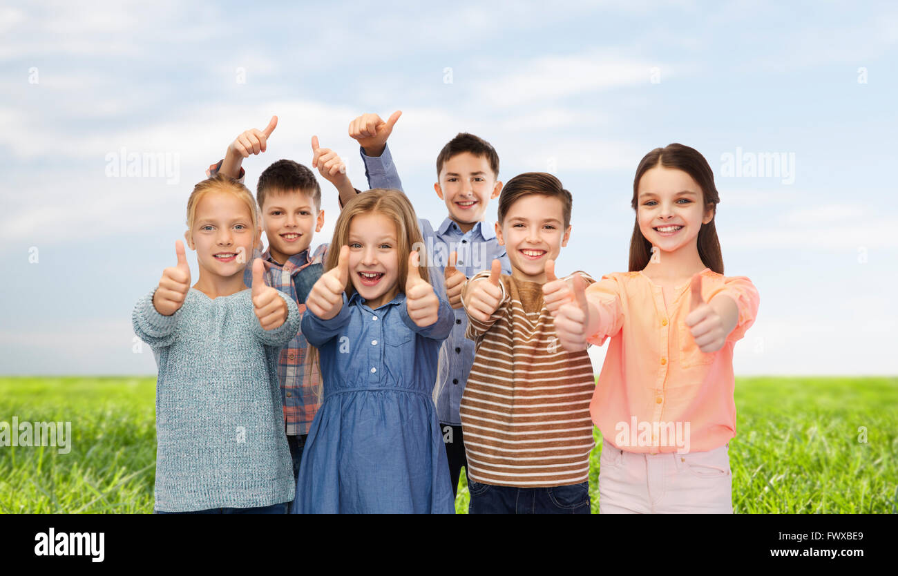 happy children showing thumbs up Stock Photo - Alamy