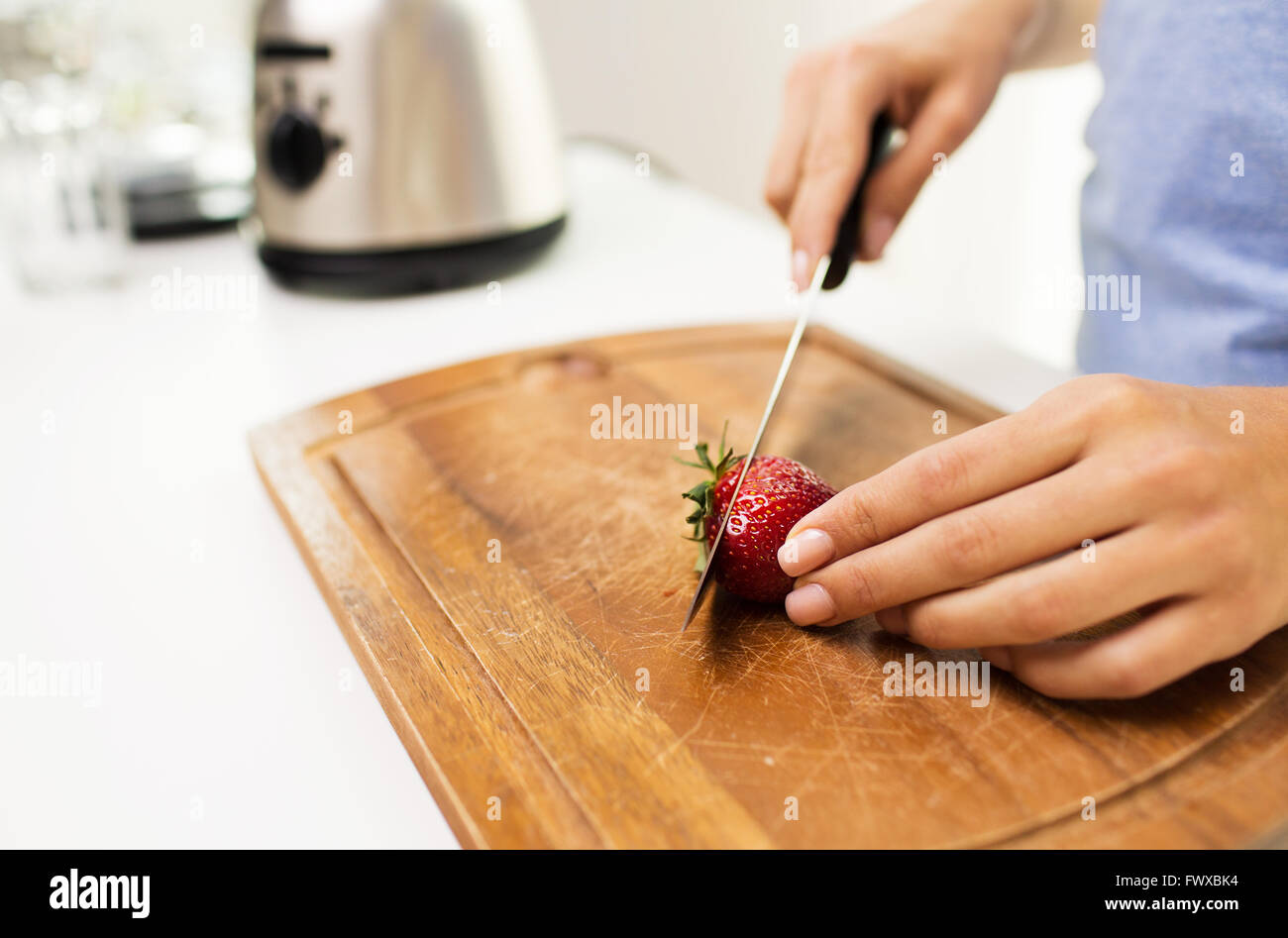 close up of woman chopping strawberry at home Stock Photo - Alamy