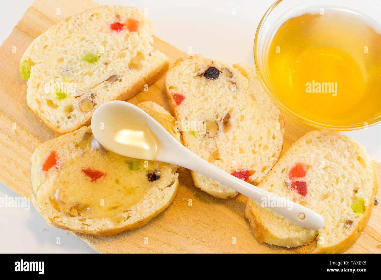 Fruit bread and honey on white. Healthy sweet snack Stock Photo - Alamy