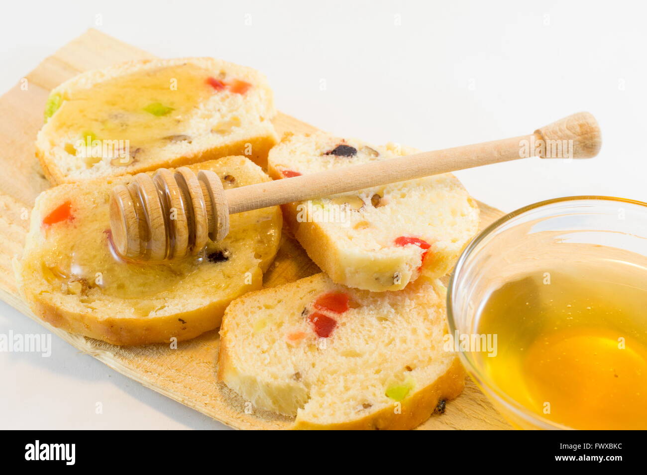 Fruit bread and honey on white. Healthy sweet snack Stock Photo - Alamy