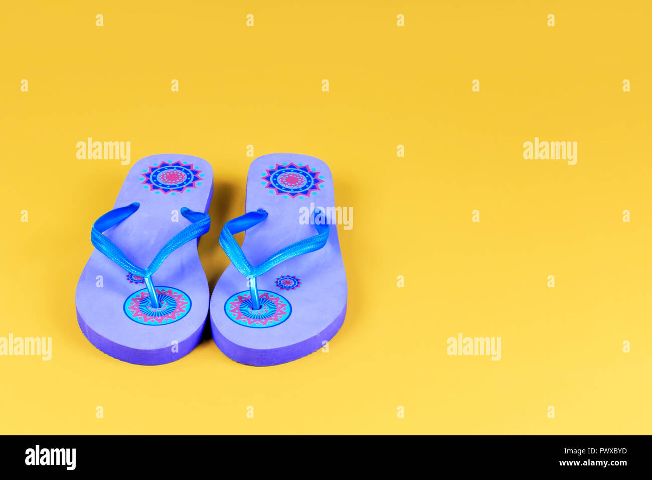Yellow flip flops hi-res stock photography and images - Alamy