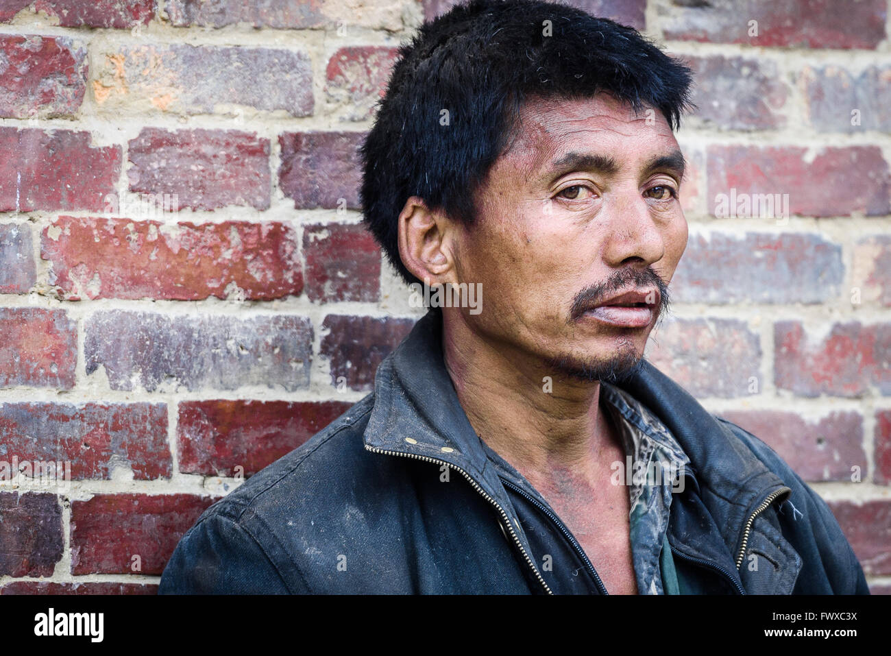 A Portrait of a man looking suspiciously at the camera Stock Photo - Alamy