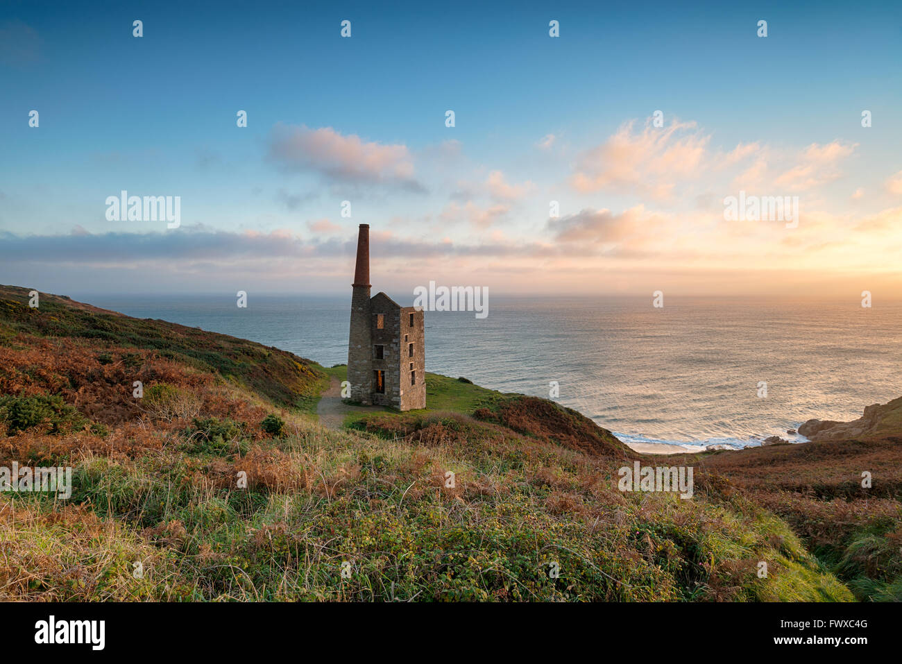An iconic Cornish Engine House perched on cliffs at Rinsey Head on the ...