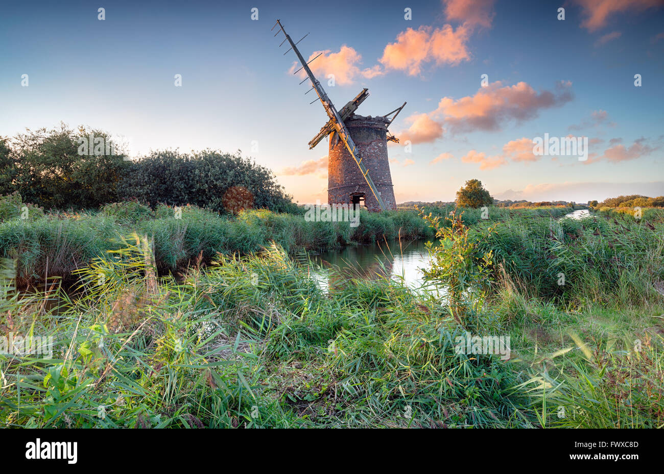 Sunset over Brograve Mill on the Norfolk Broads Stock Photo - Alamy