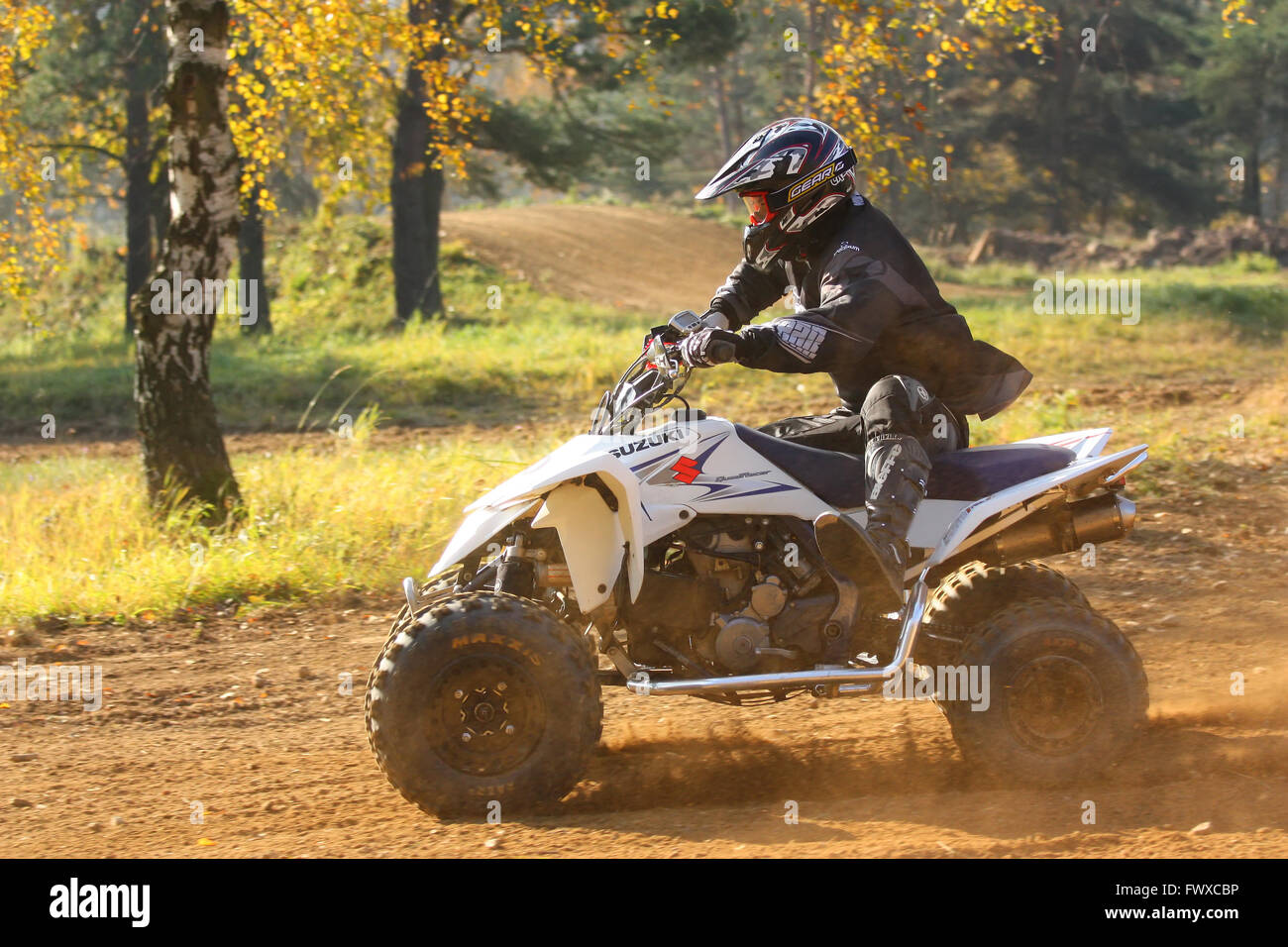 Side view of the quad racer in action Stock Photo - Alamy