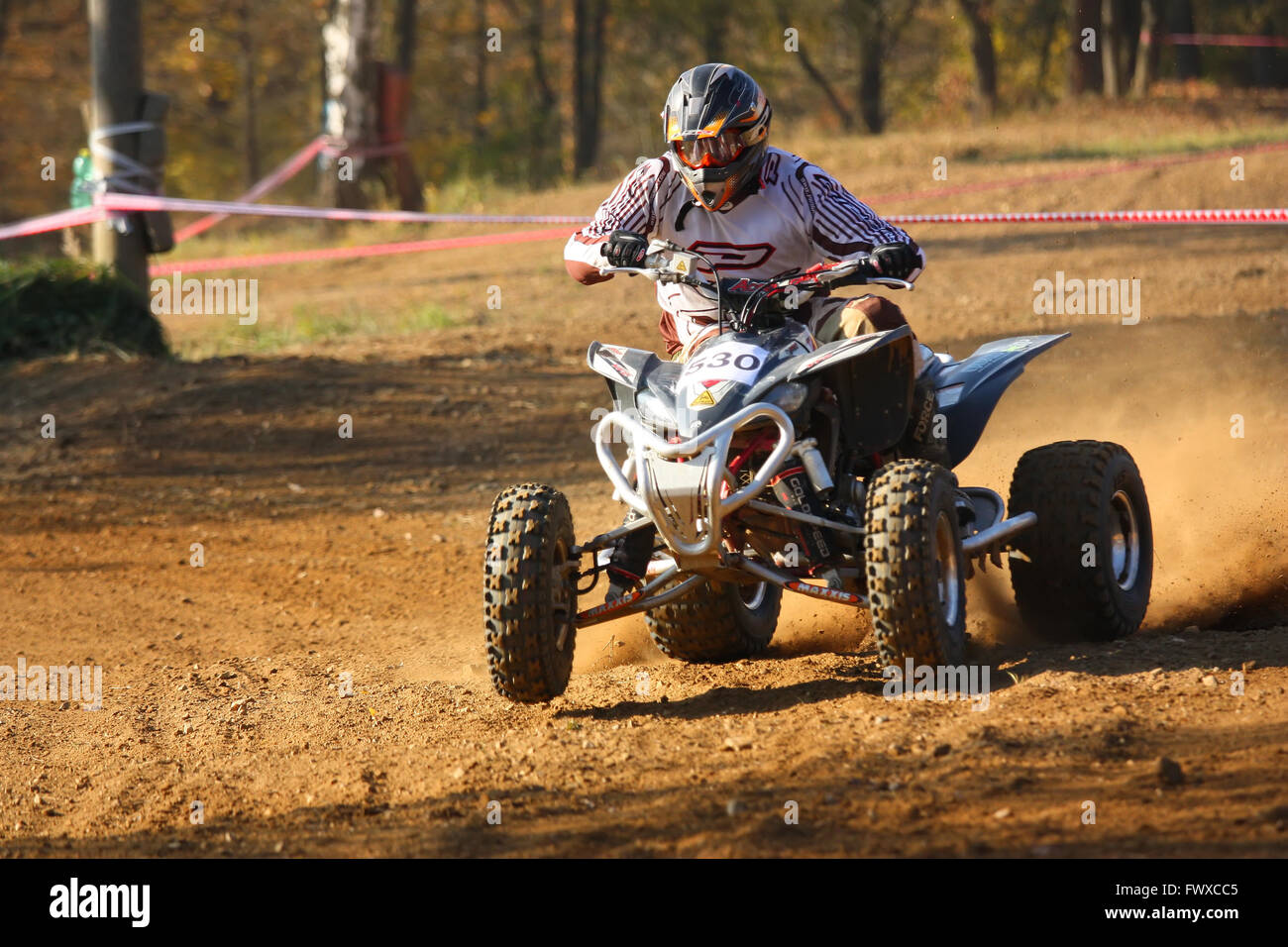 Front view of quad rider when accelerating out of a turn Stock Photo ...