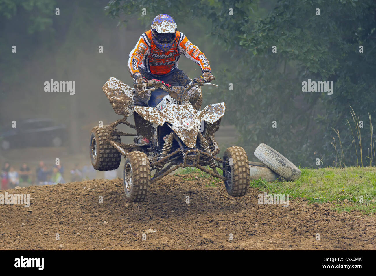 Racer is jumping in the quad motorbike race Stock Photo - Alamy
