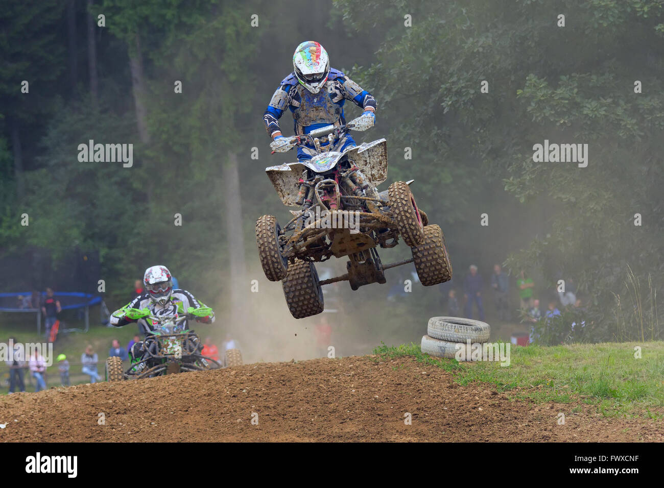 Racer is jumping quad in the quad race Stock Photo - Alamy