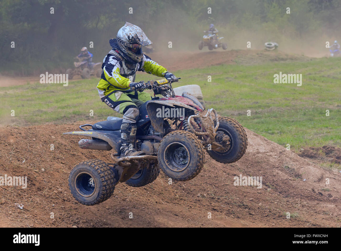Young quad racer is jumping in the race Stock Photo - Alamy
