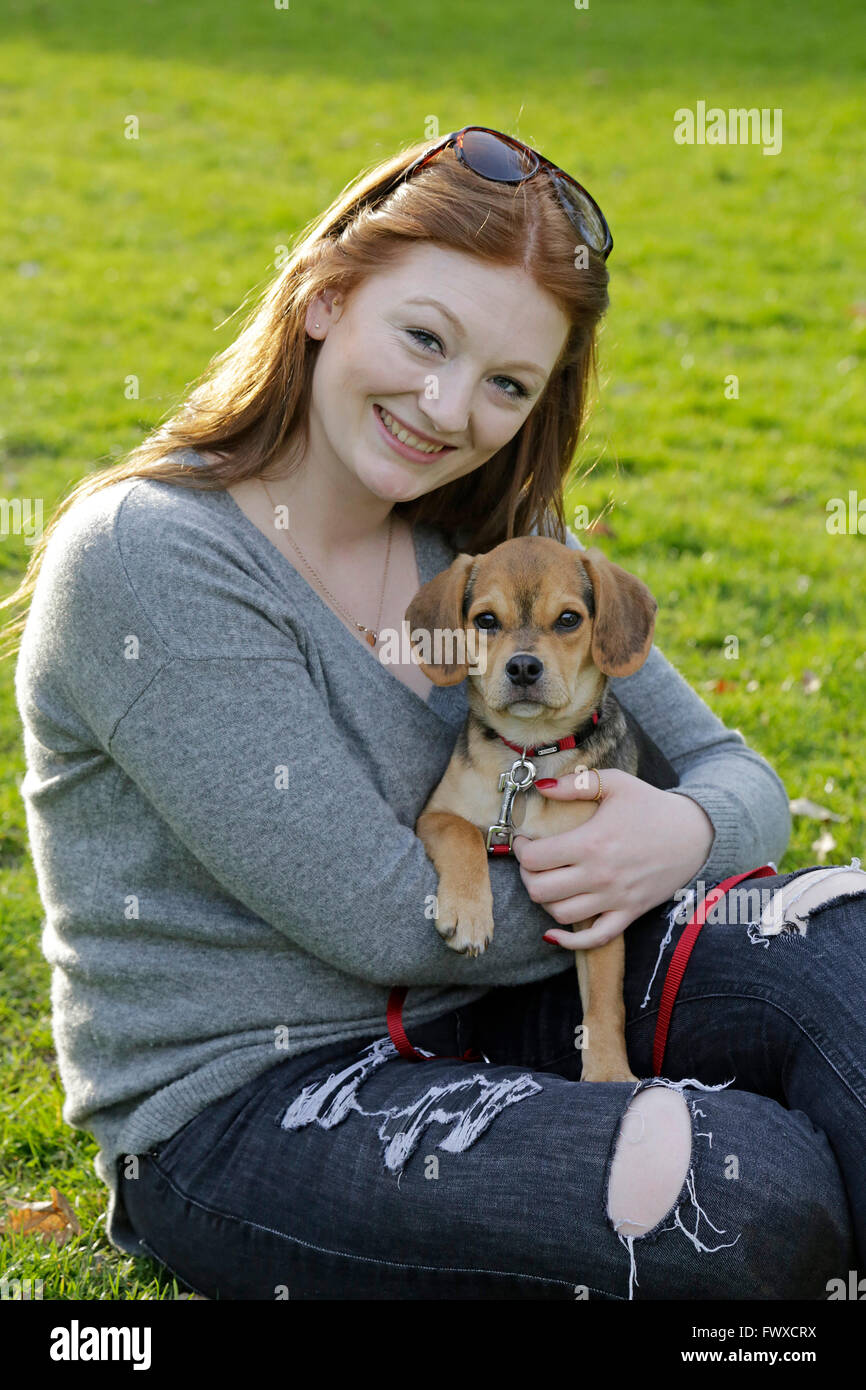 portrait of a young woman with her small dog Stock Photo - Alamy