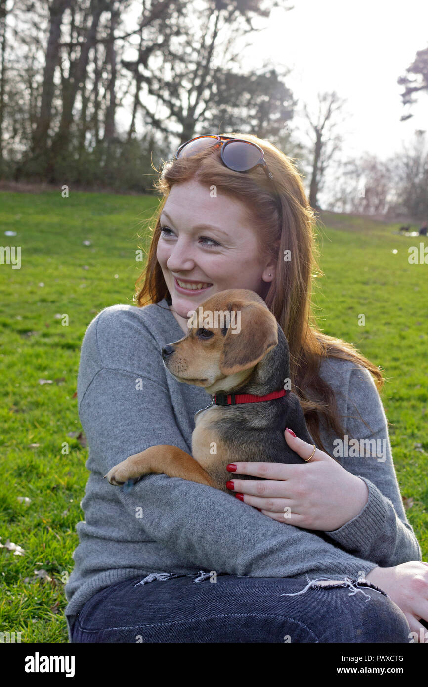 portrait of a young woman with her small dog Stock Photo - Alamy
