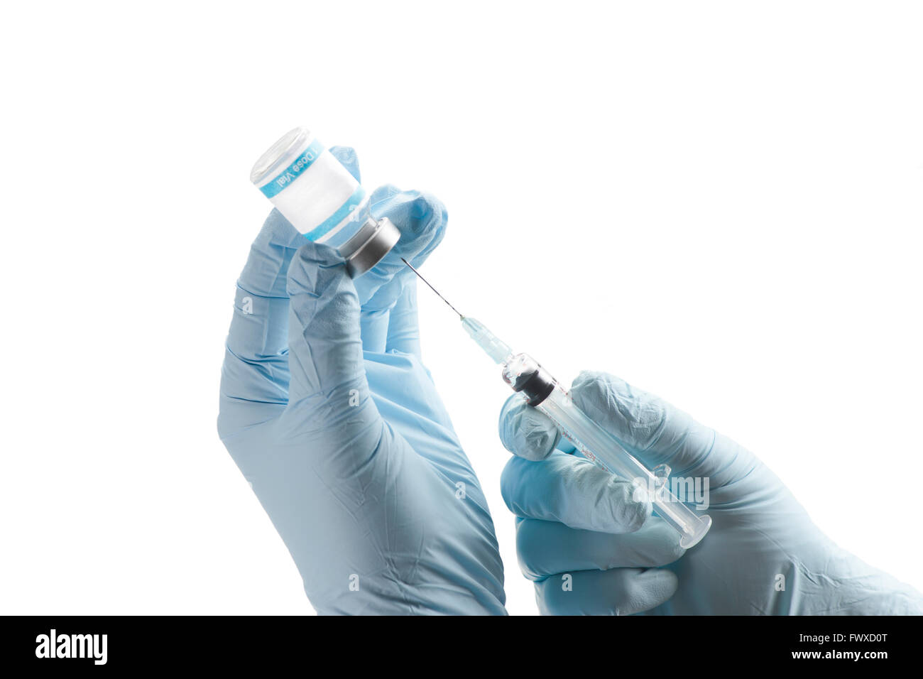 Nurse prepares to draw medication from glass vial Stock Photo - Alamy