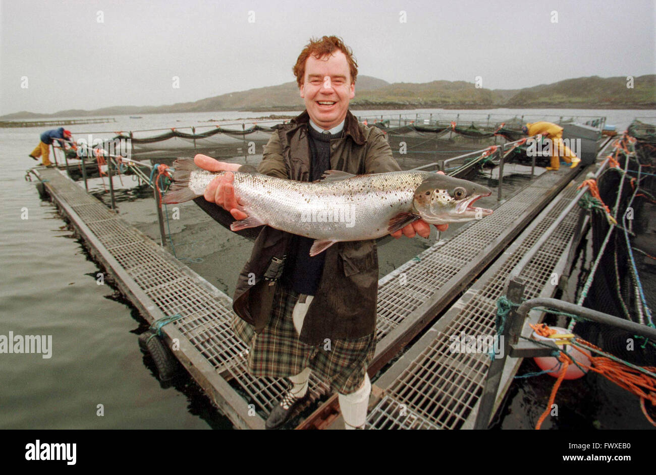 Cree MacKenzie with one of his farmed salmon from Great Bernera in the ...