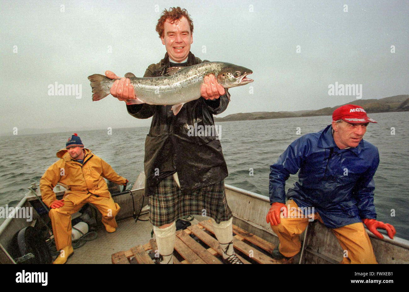 Cree MacKenzie with one of his farmed salmon from Great Bernera in the ...