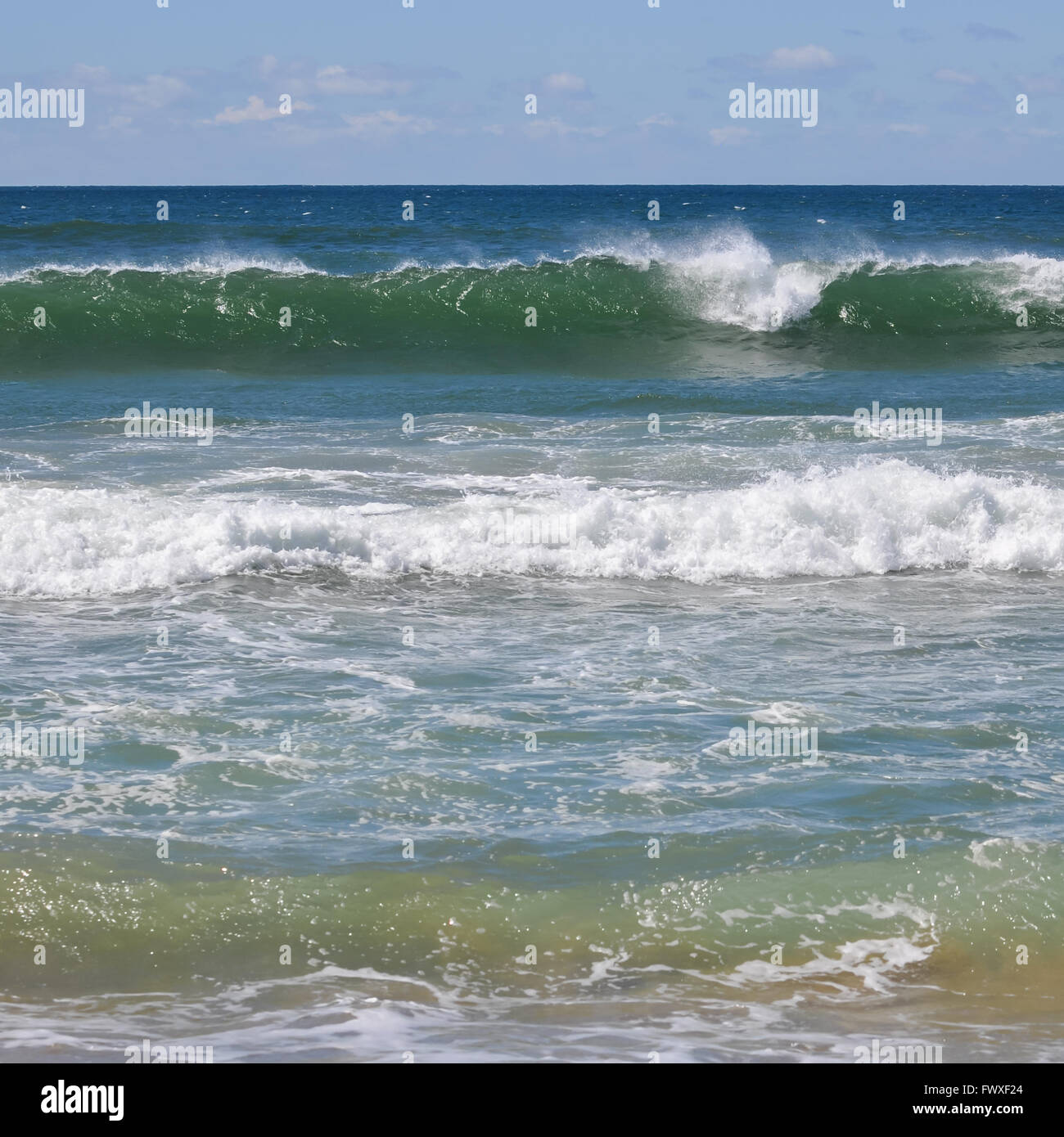 Waves Breaking at the Beach Square Format Stock Photo - Alamy