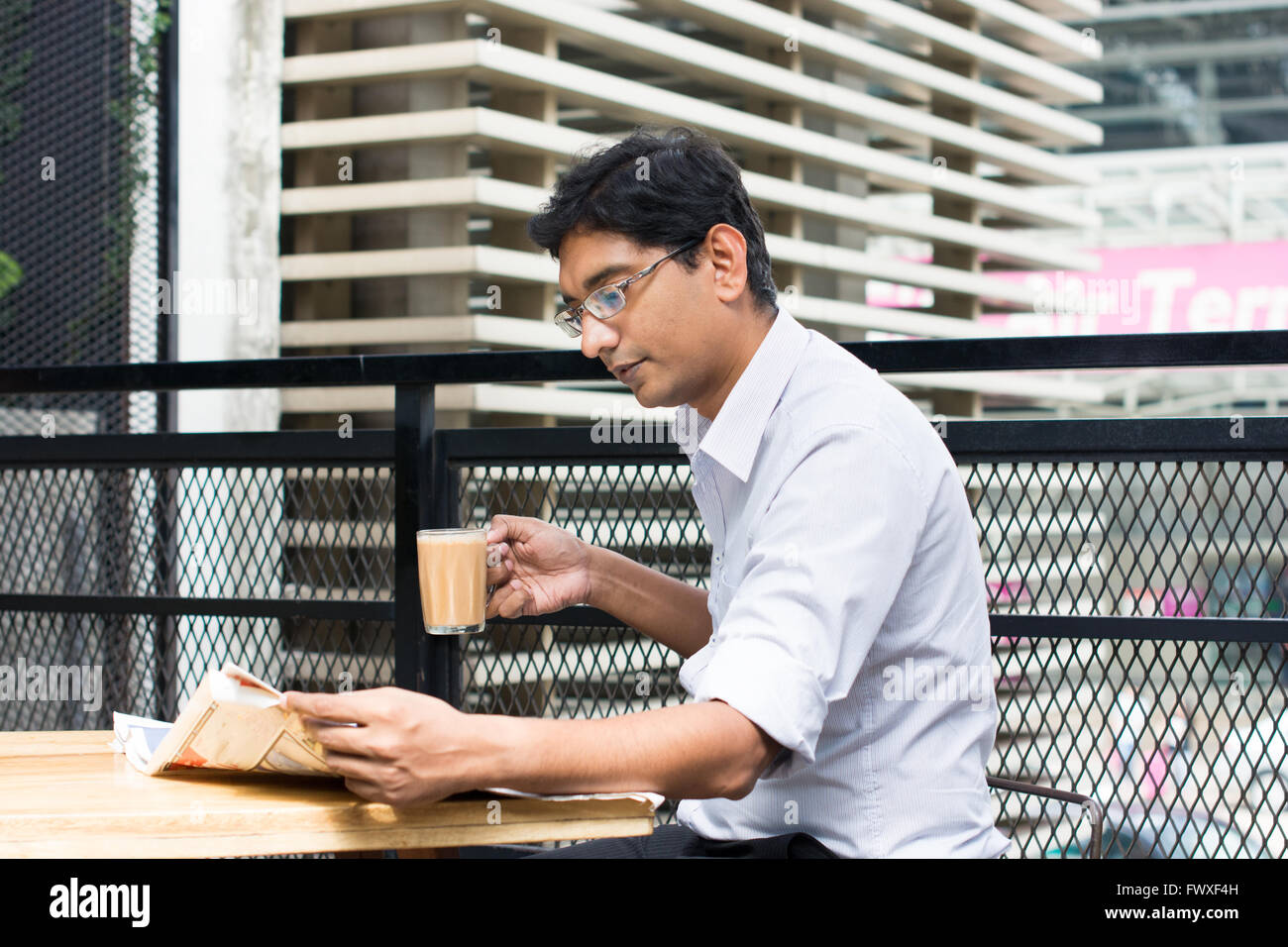 Asian man having tea break hi-res stock photography and images - Alamy