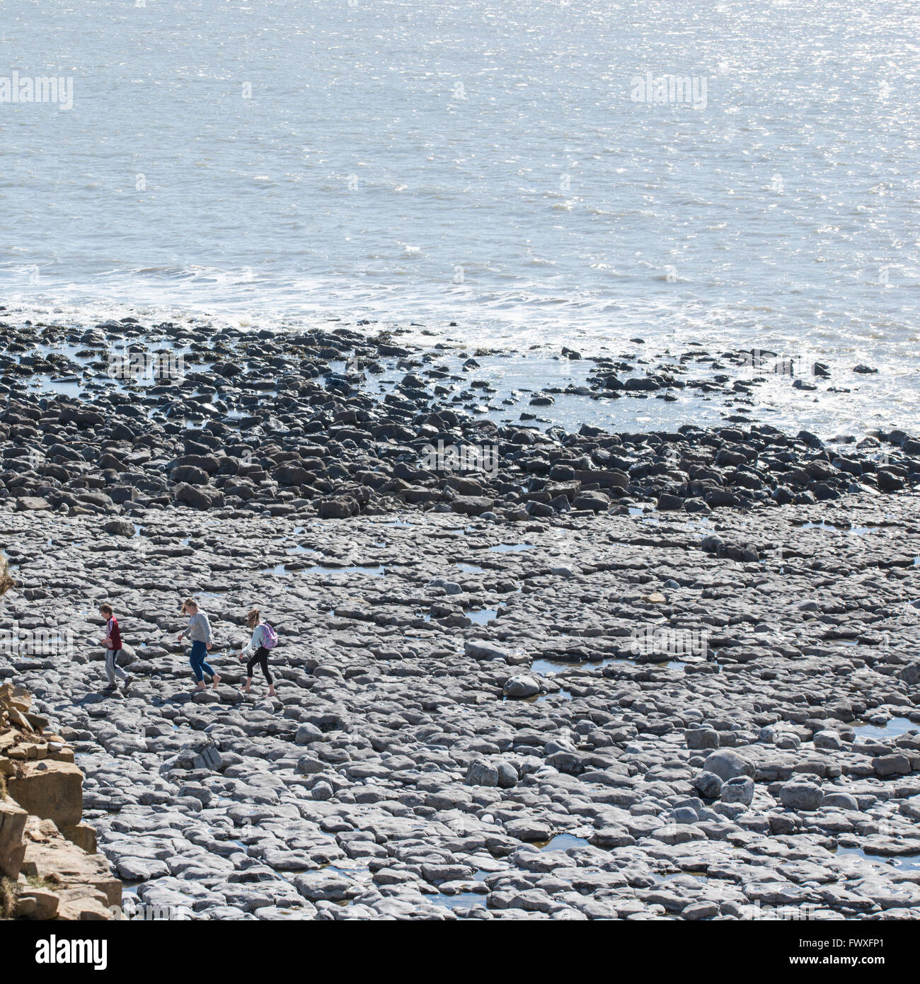 Children on rocks hi-res stock photography and images - Alamy