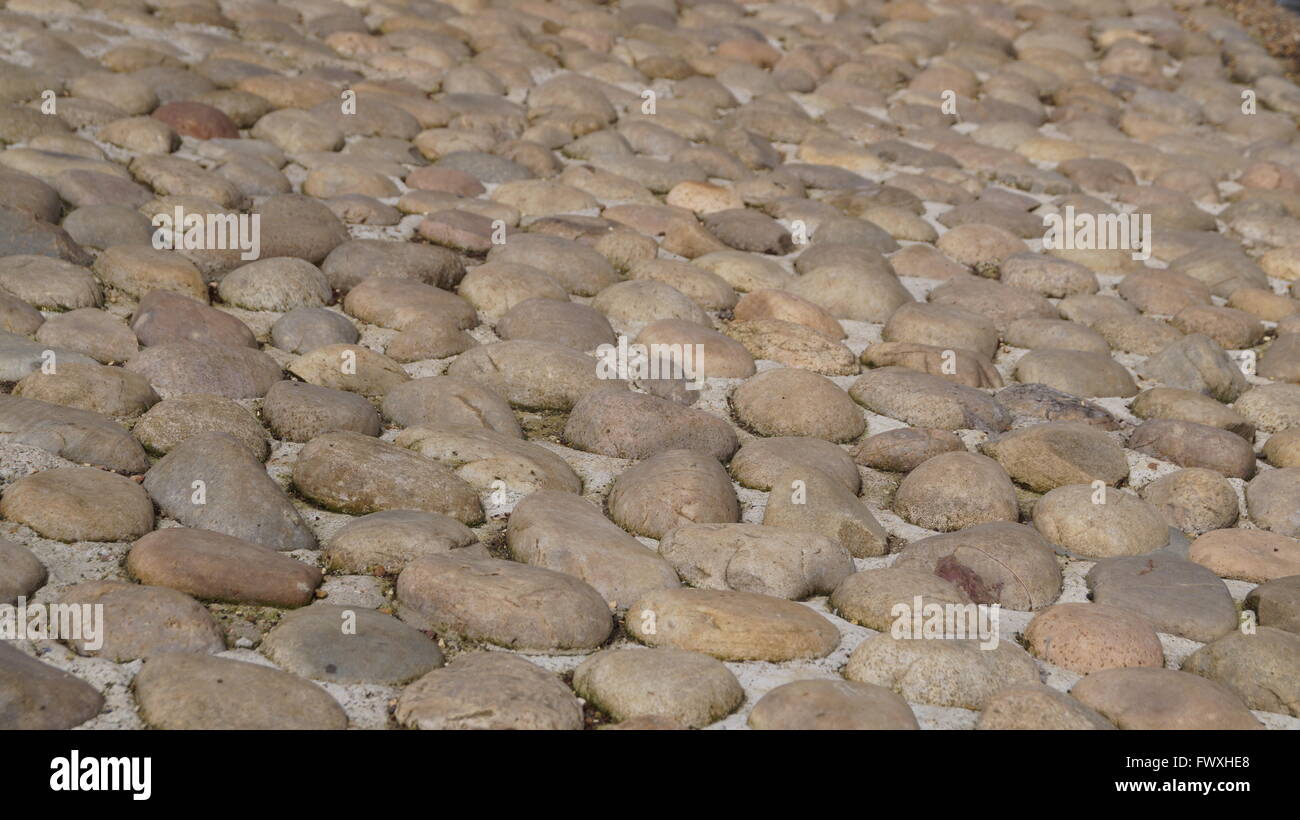 Pebbles lined up as abstract wallpaper Stock Photo - Alamy