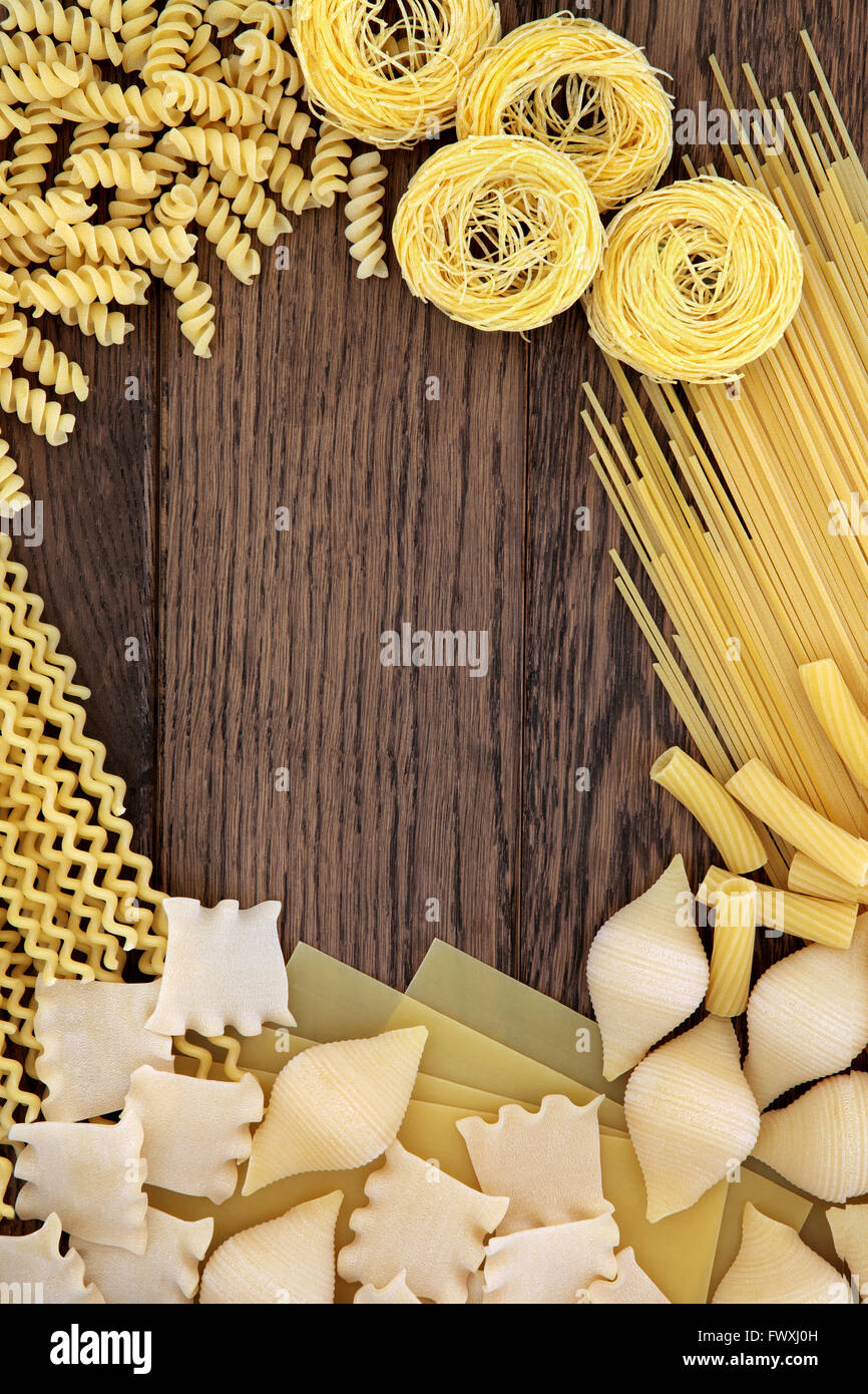 Abstract pasta food background border over old oak wood Stock Photo - Alamy
