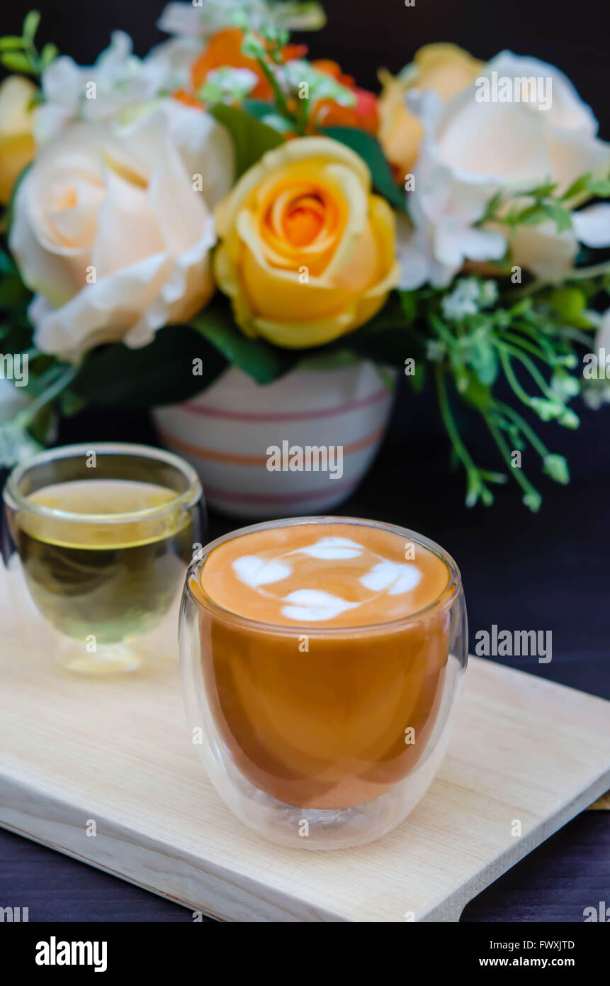 Glass hot thai tea cup with white foam surface and hot tea Stock Photo ...
