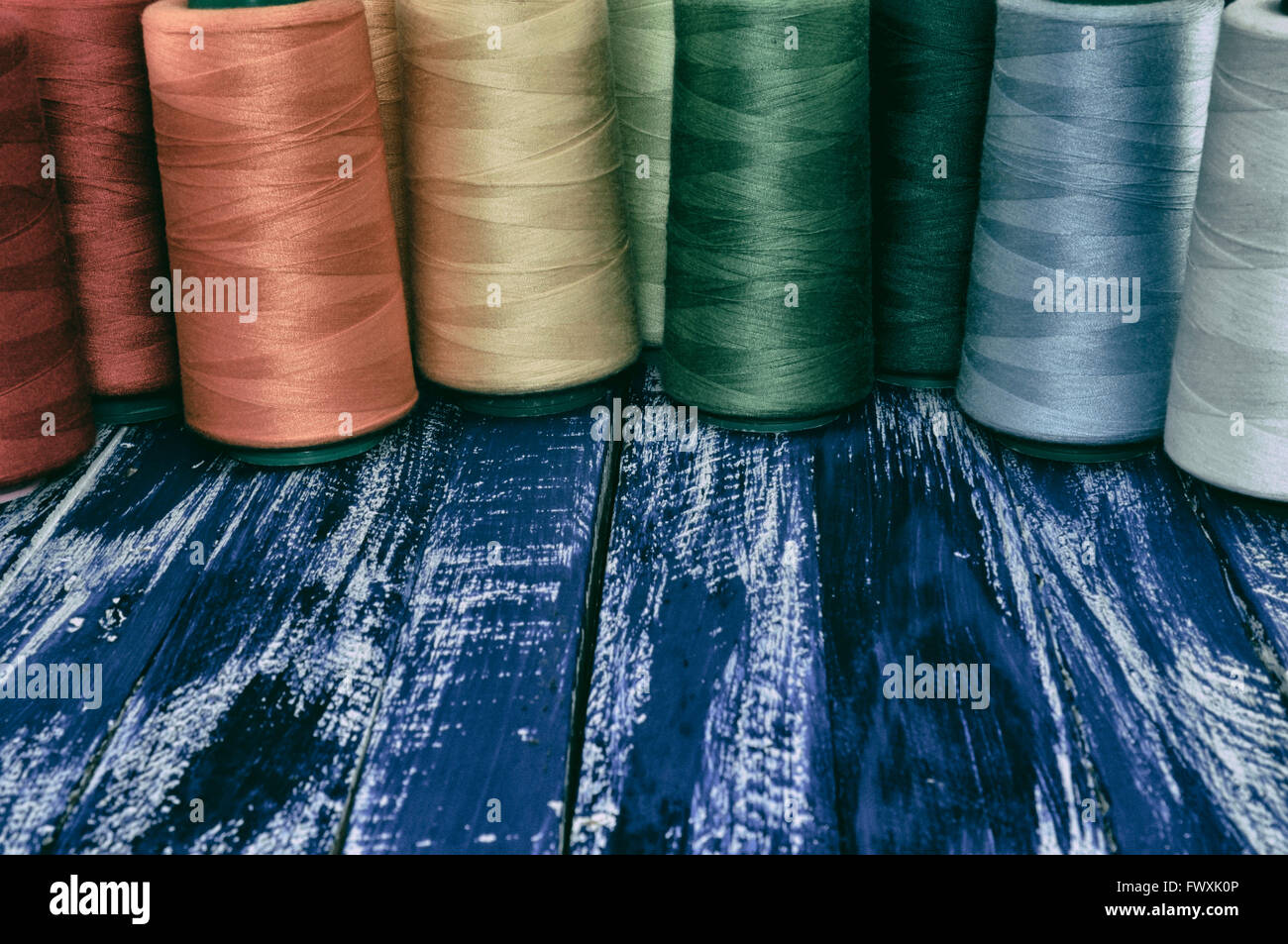 Vintage photo of multi-colored coils of sewing and embroidery on the ...
