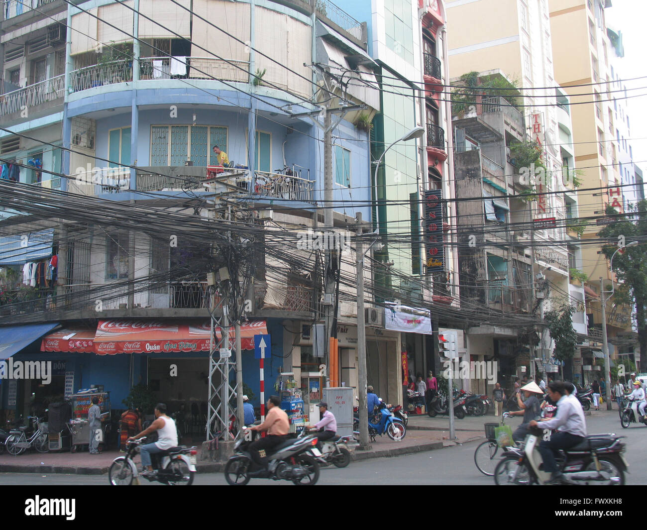 Tangle of overhead wires at a busy intersection Stock Photo - Alamy