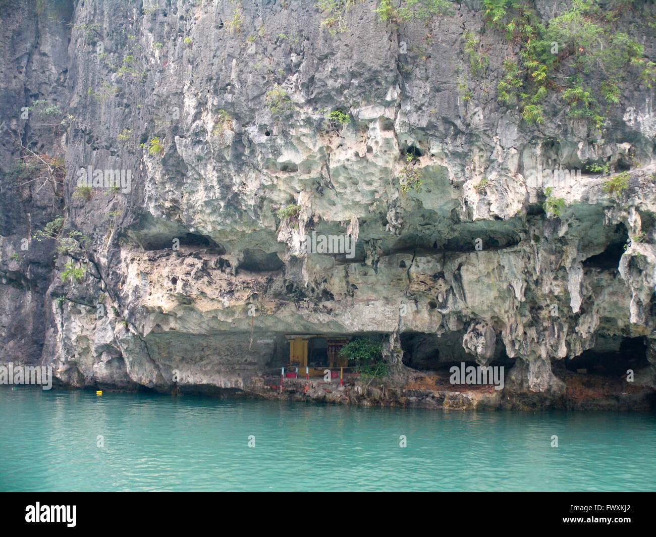 Buddhist makeshift temple in a cave in Halong Bay, Vietnam Stock Photo ...