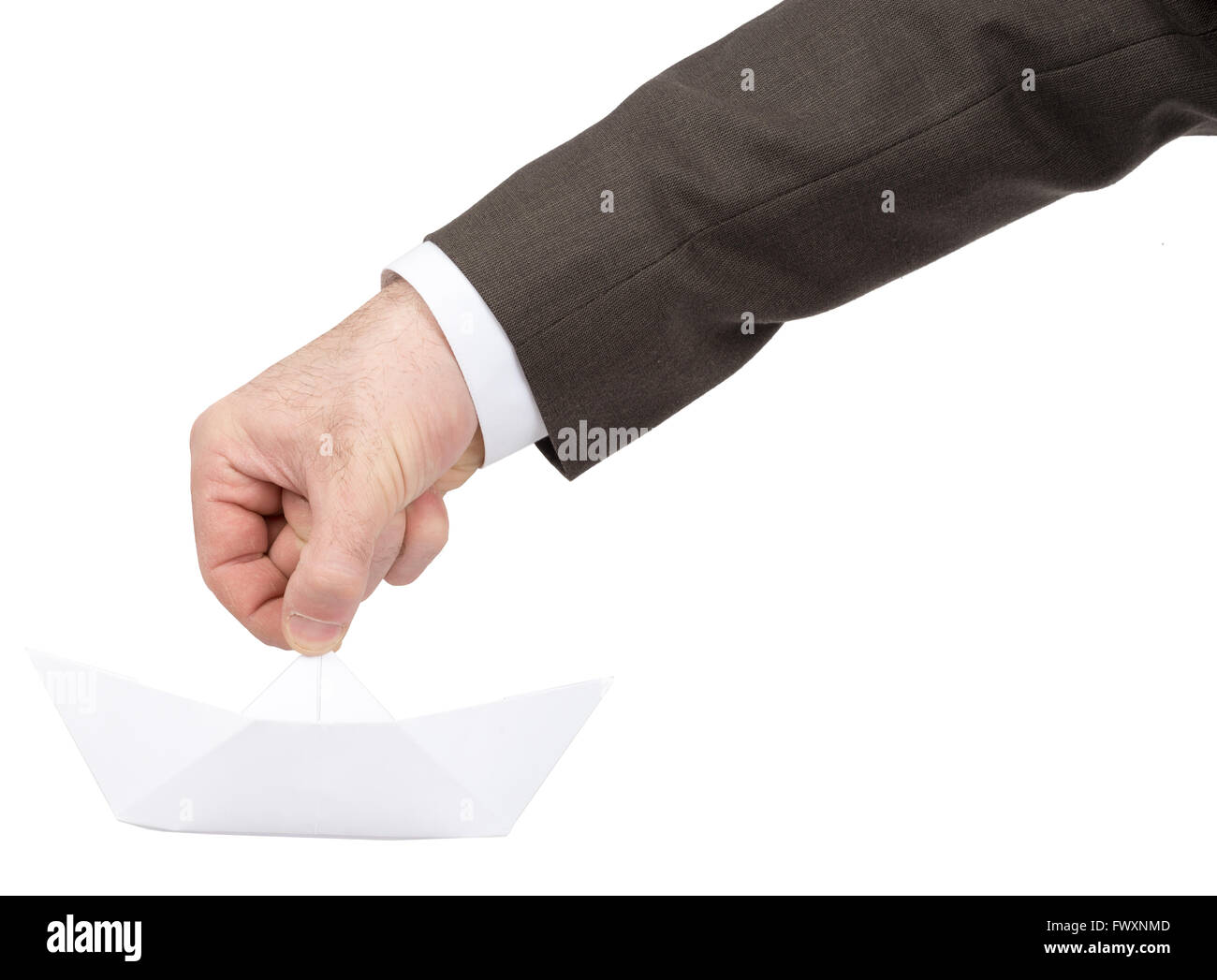 Businessmans hand holding paper boat Stock Photo - Alamy
