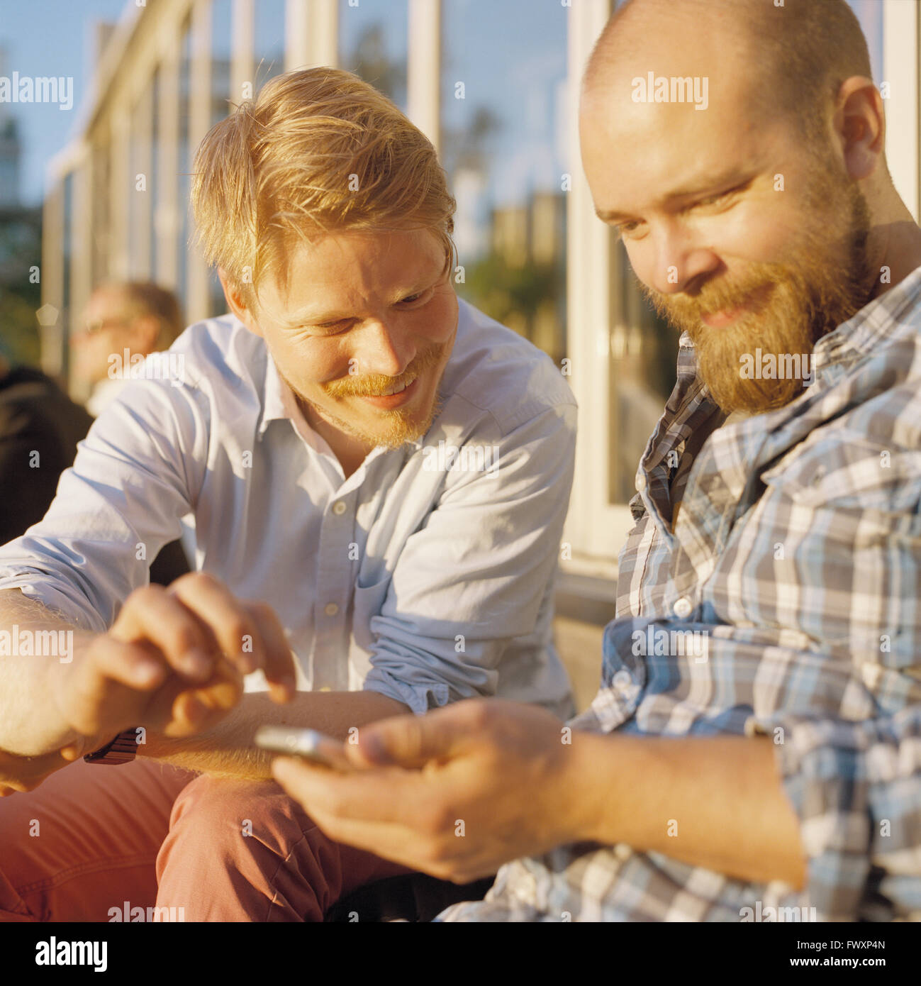 Men at the phone hi-res stock photography and images - Alamy