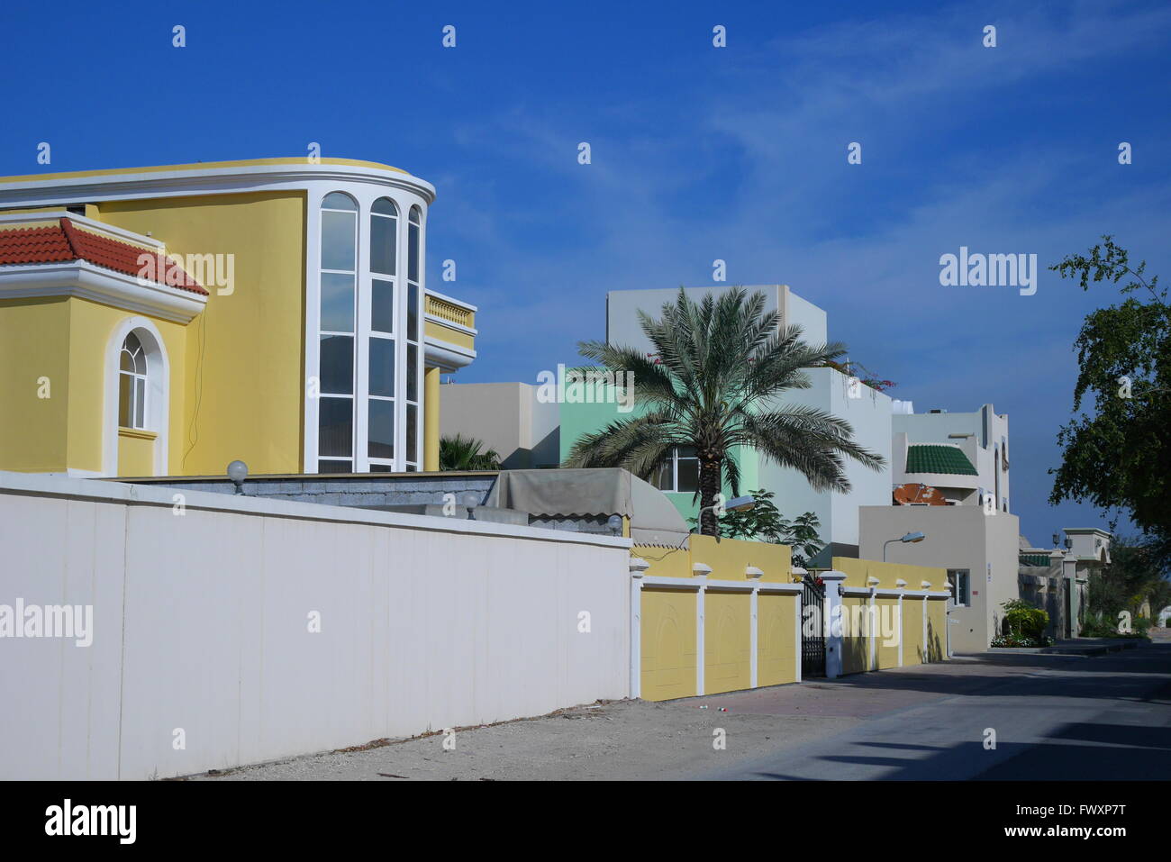 Villas on a street in Al Markh village, near Saar, Kingdom of Bahrain ...