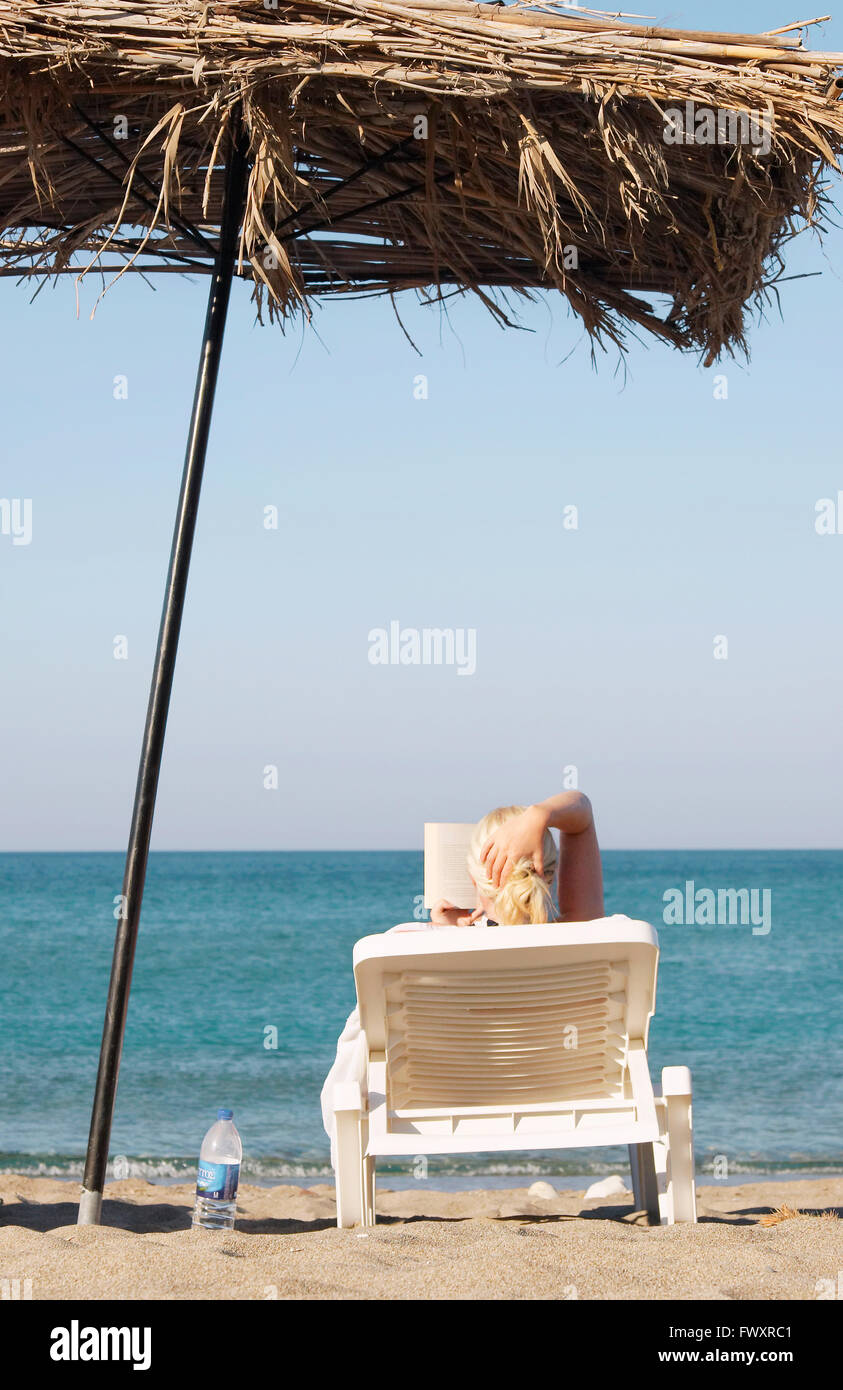 Greece beach sunbathing woman hi-res stock photography and images - Alamy