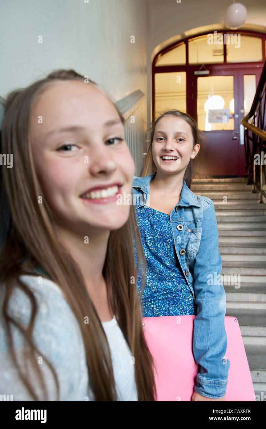 Two smiling girls school hi-res stock photography and images - Alamy