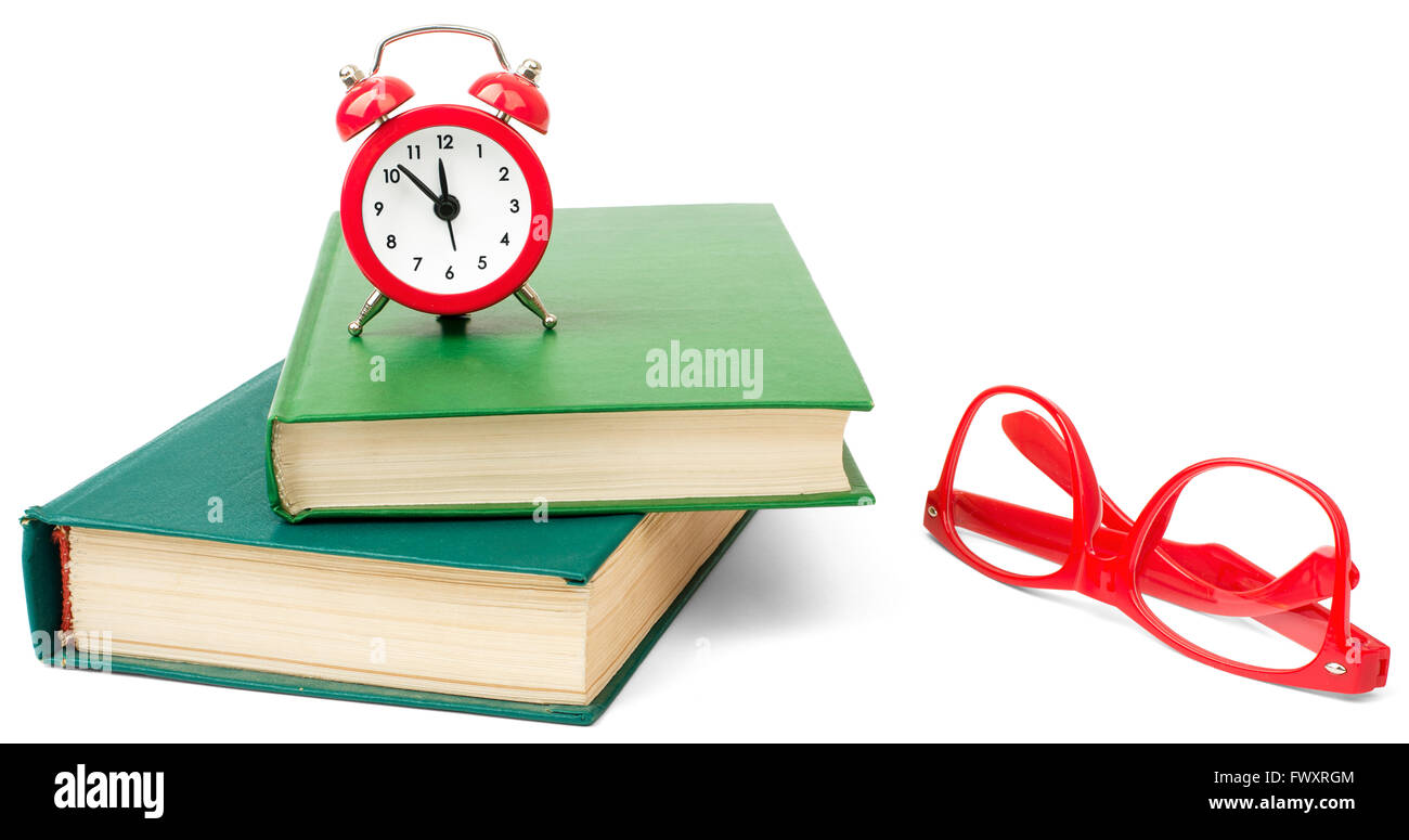 Books with alarm clock Stock Photo - Alamy